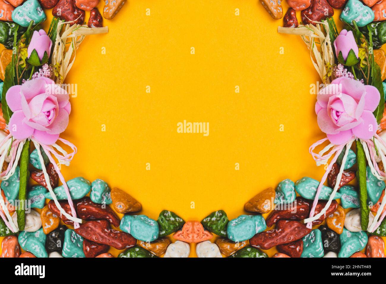 Festive decoration. candy pebbles on a yellow background. sweets in the ...