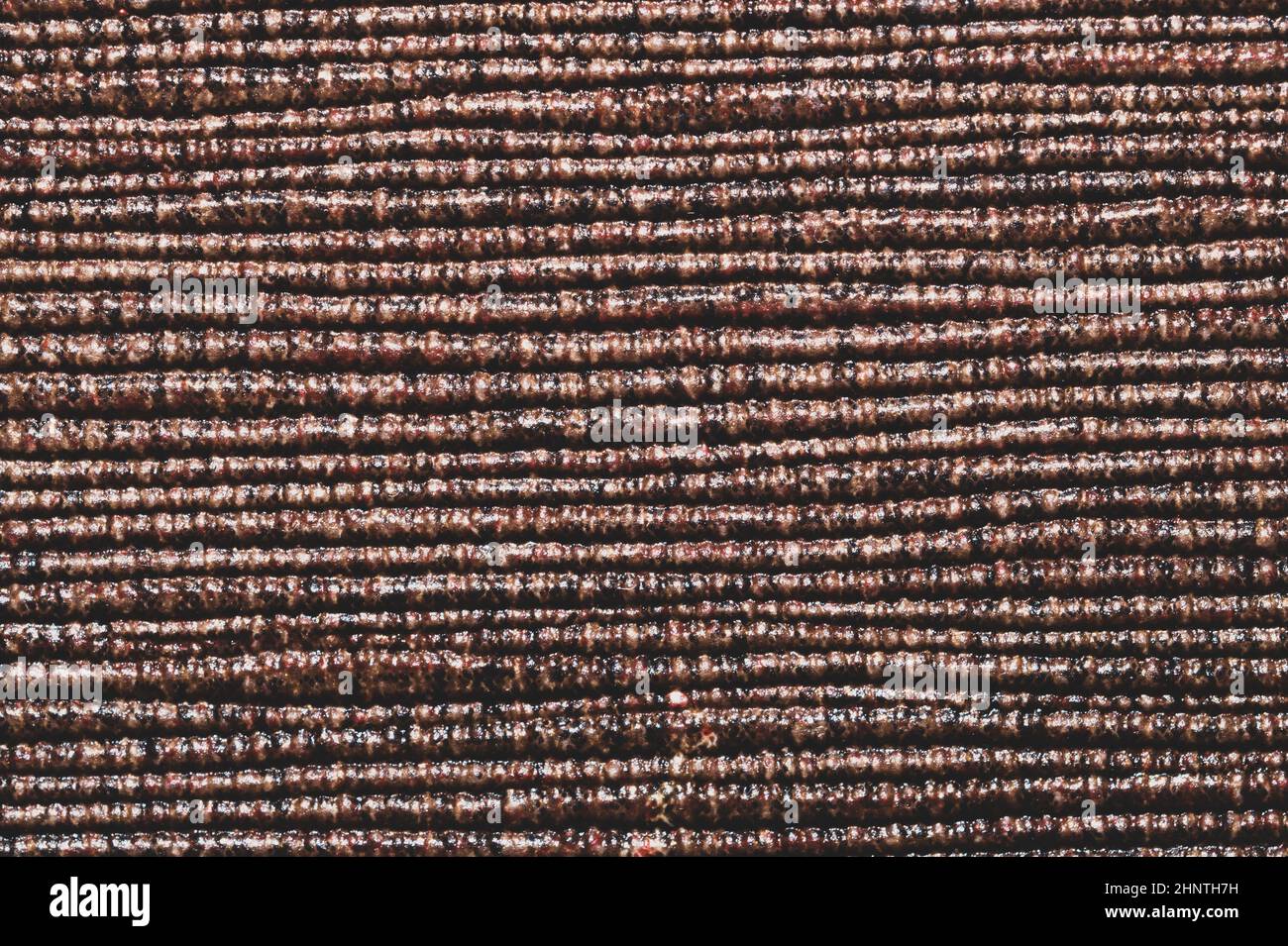 Abstract brown ribbed texture. extremely macro background of wall ...