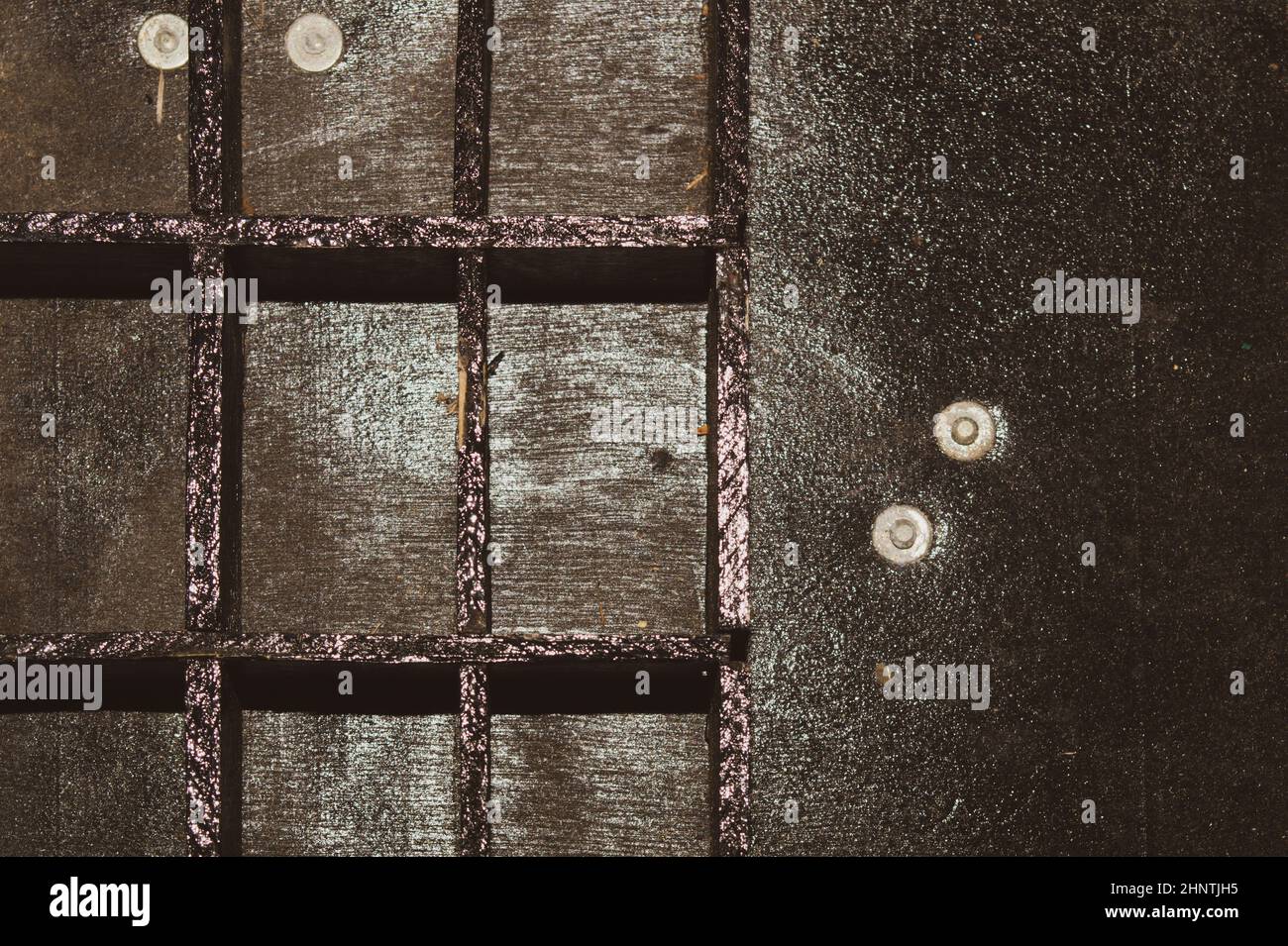 Old wooden box with cells. shelves in a black wooden rack. empty ...