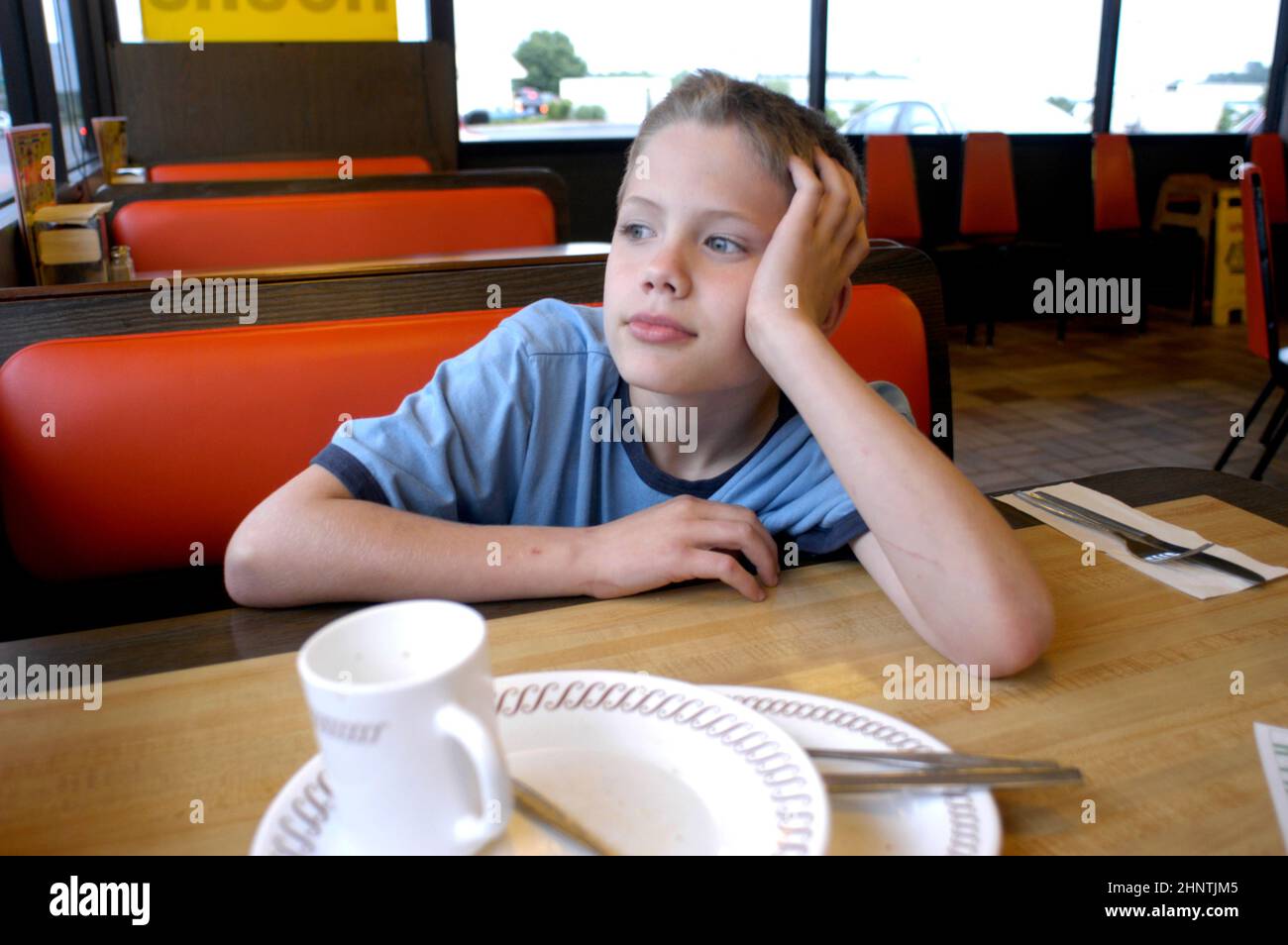 (MR) 10 year old boy After eating a full meal in the 'Waffle House" in ...