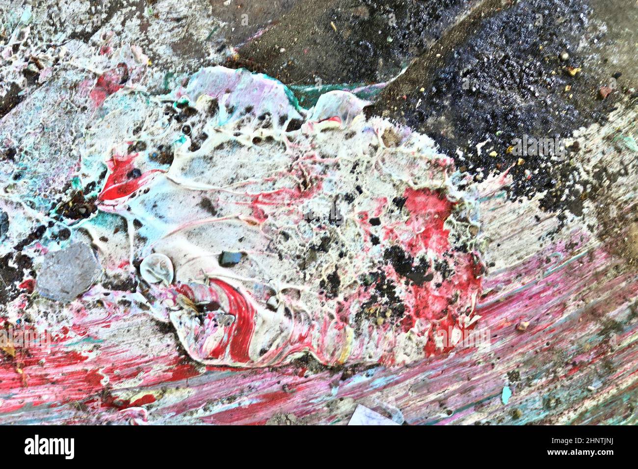 Colorful graffiti paint splashes on the wall and ground at a lost place ...