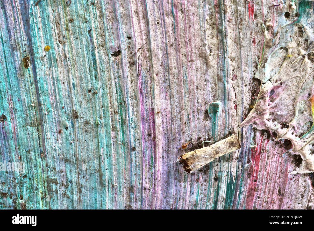 Colorful graffiti paint splashes on the wall and ground at a lost place ...