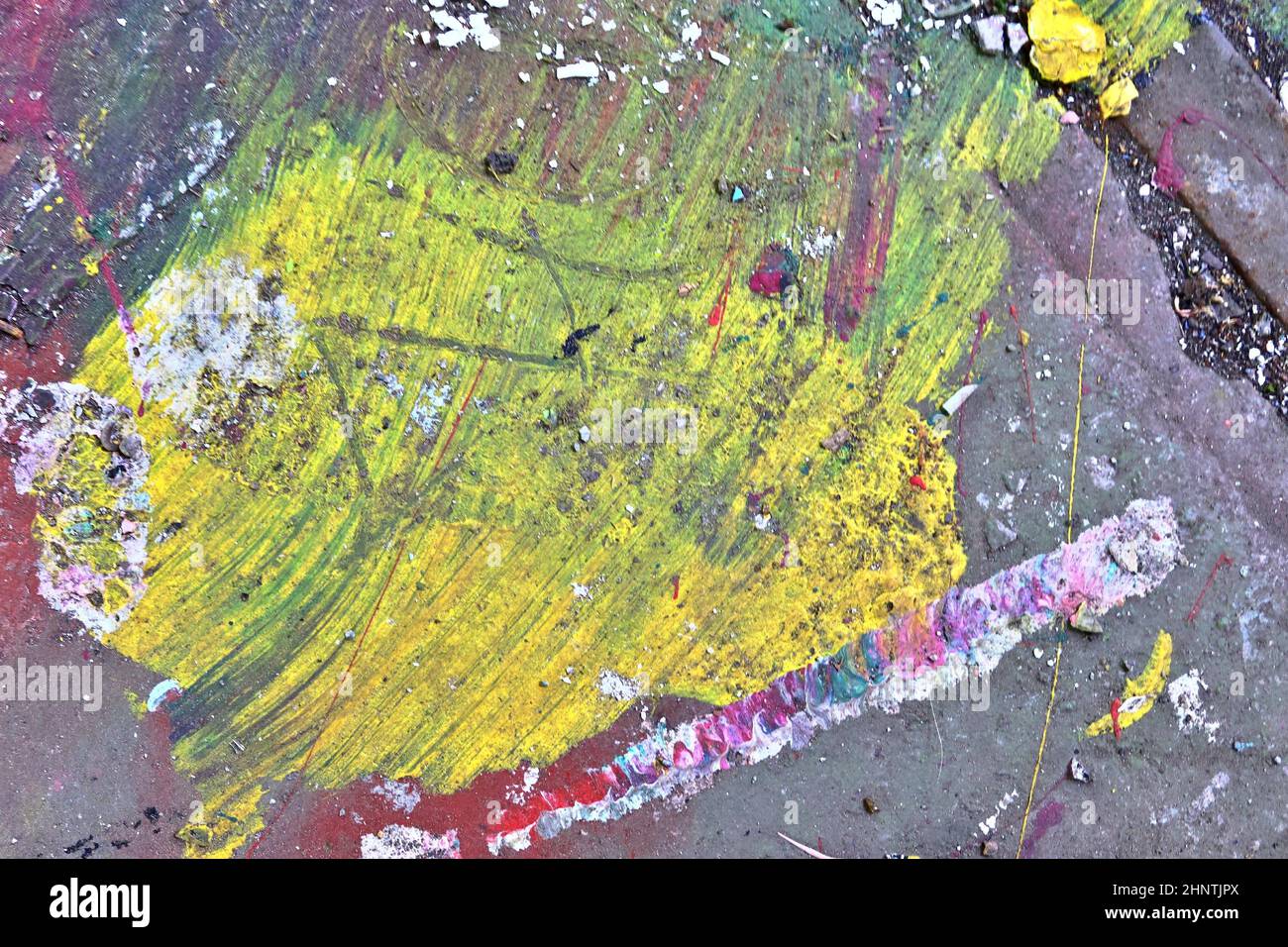 Colorful graffiti paint splashes on the wall and ground at a lost place ...