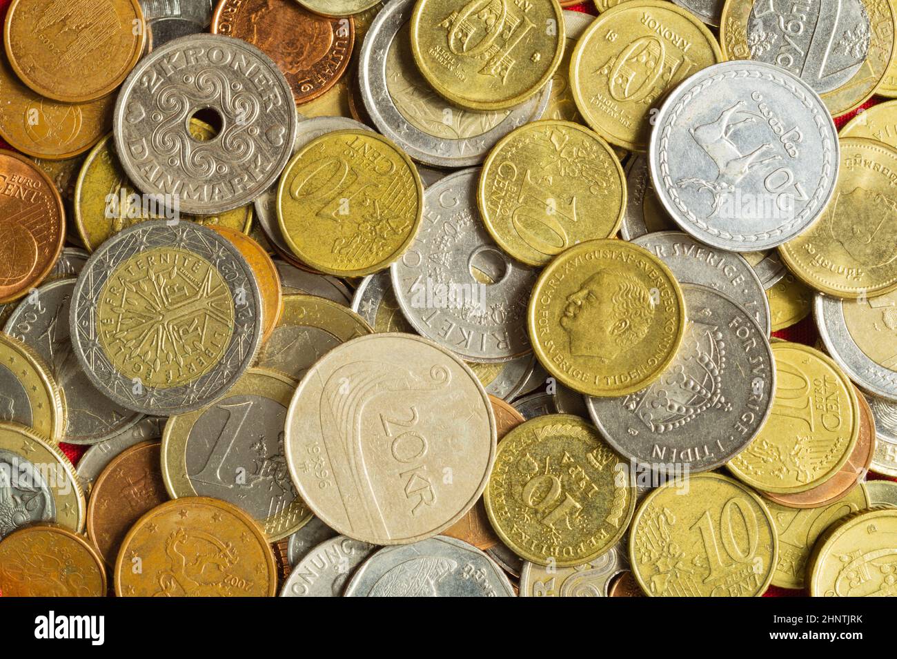 Coins of the different countries. a lot of metal coins of different ...