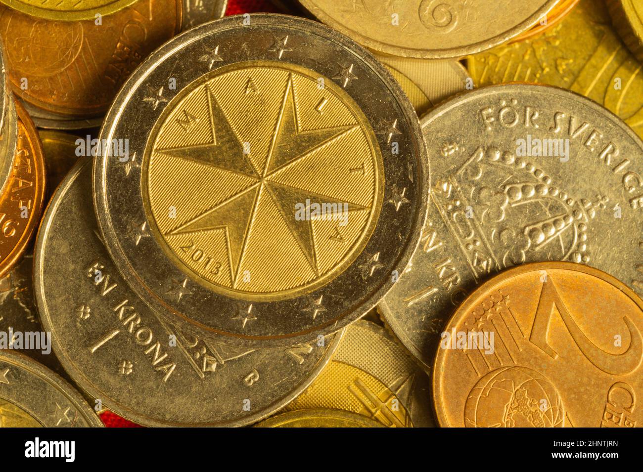 Coins of different countries. a lot of metal coins of different ...