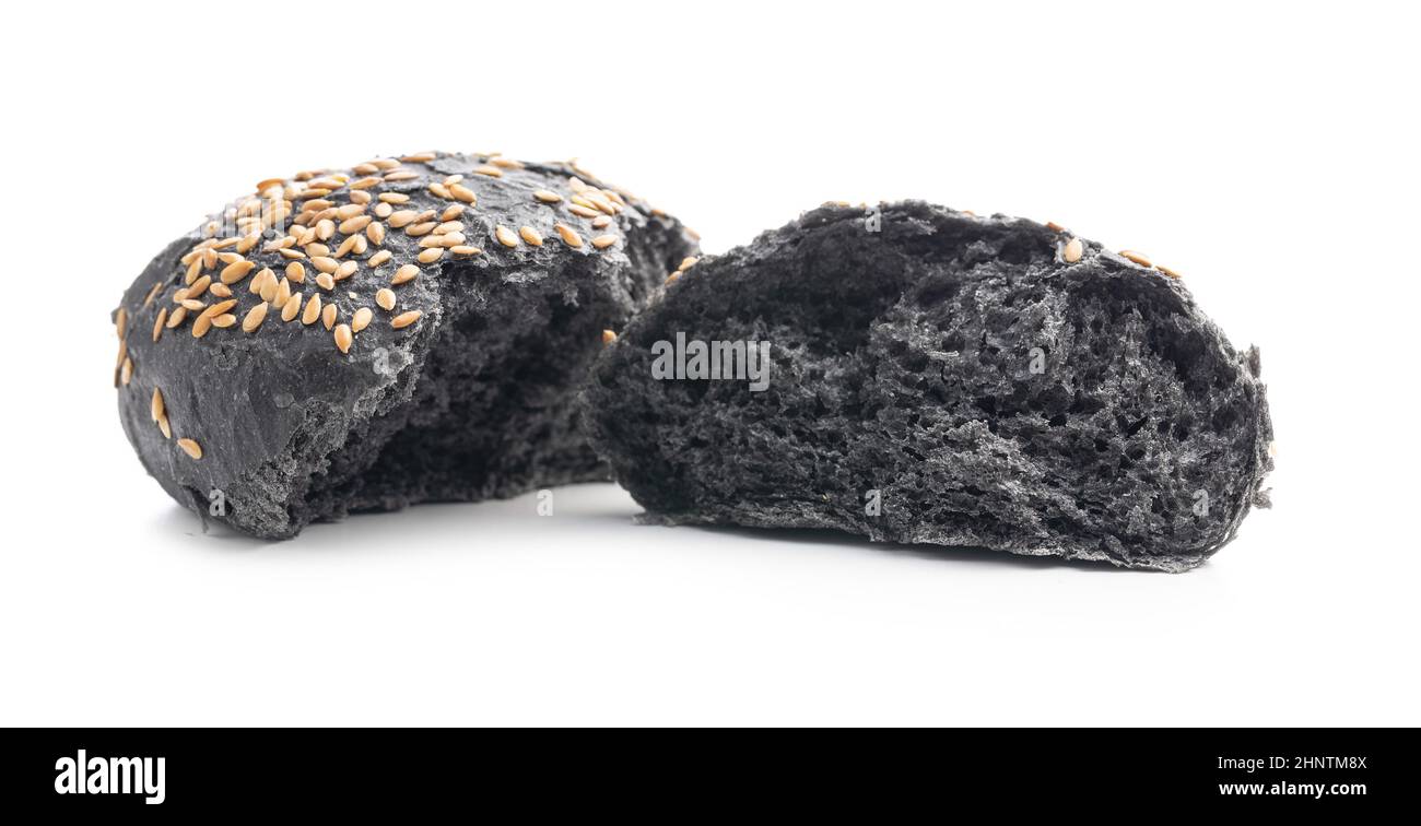 Black bun. Dark pastry with sesame seeds isolated on white background ...