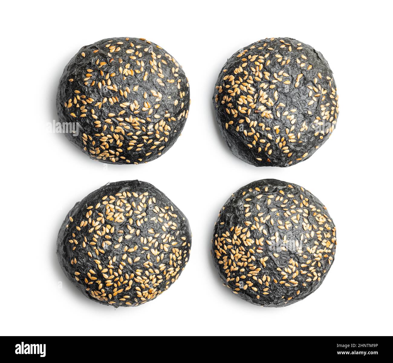 Black bun. Dark pastry with sesame seeds isolated on white background ...