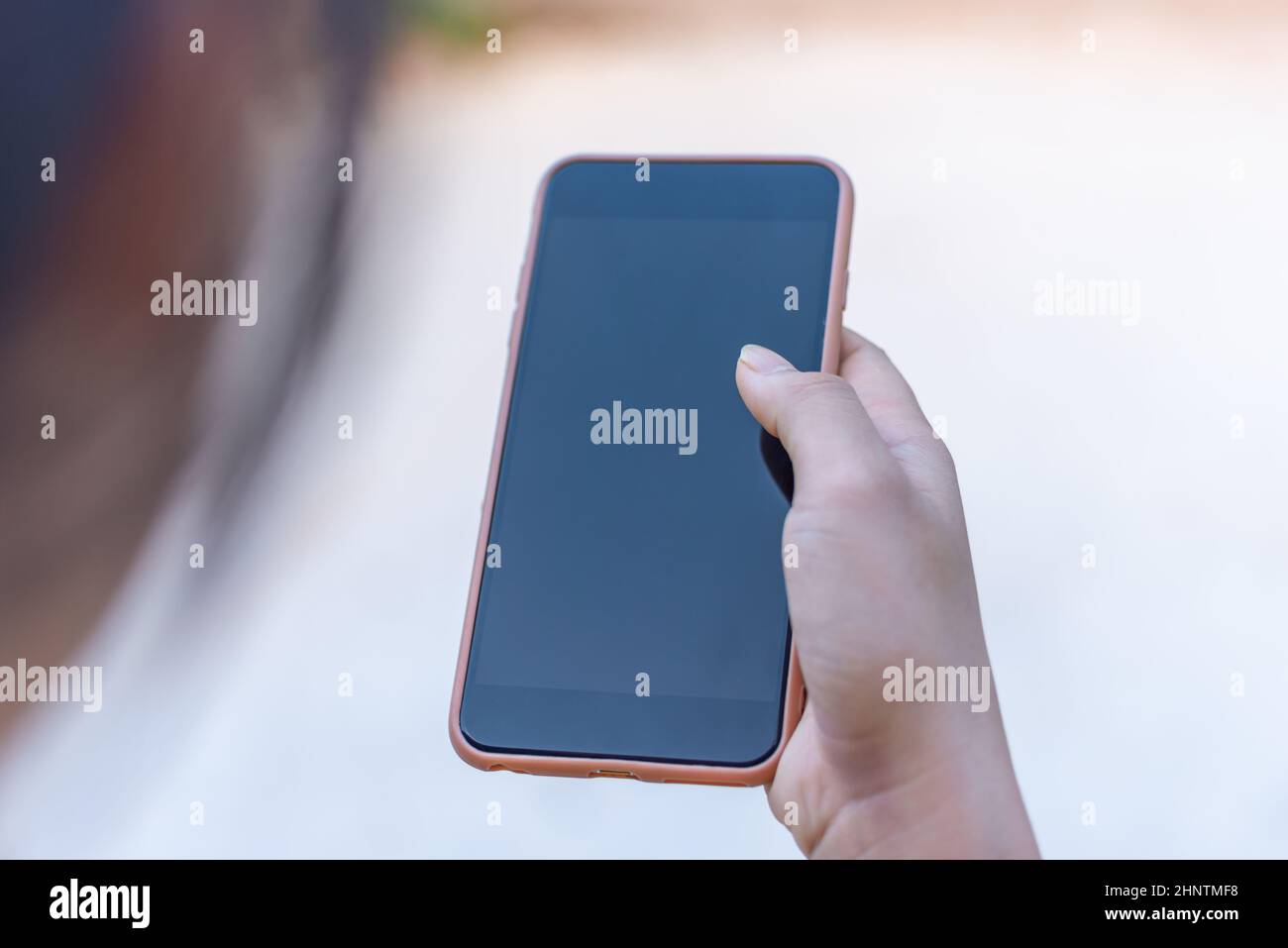 Hand women with smart phone black screen blurred background Stock Photo ...