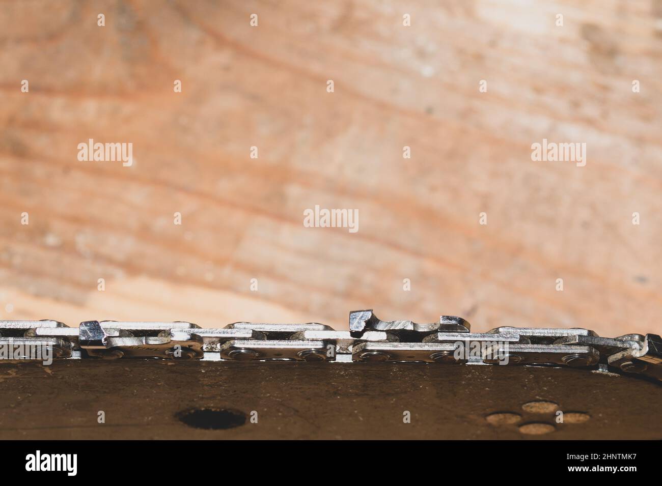 Chainsaw bar and cutting chain close up. blade of a chainsaw on a ...