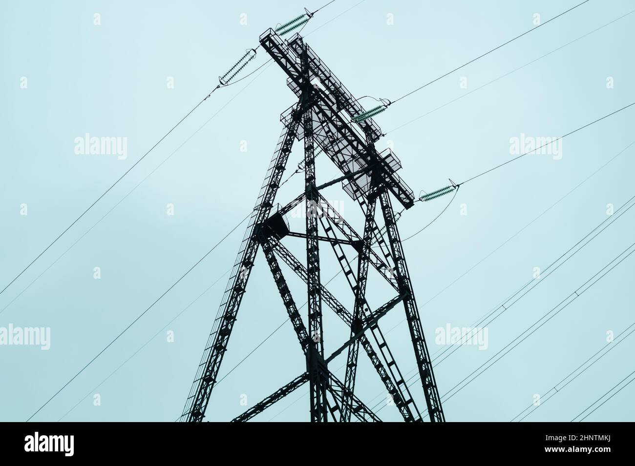 Power line posts. high voltage tower with the sky. industrial ...