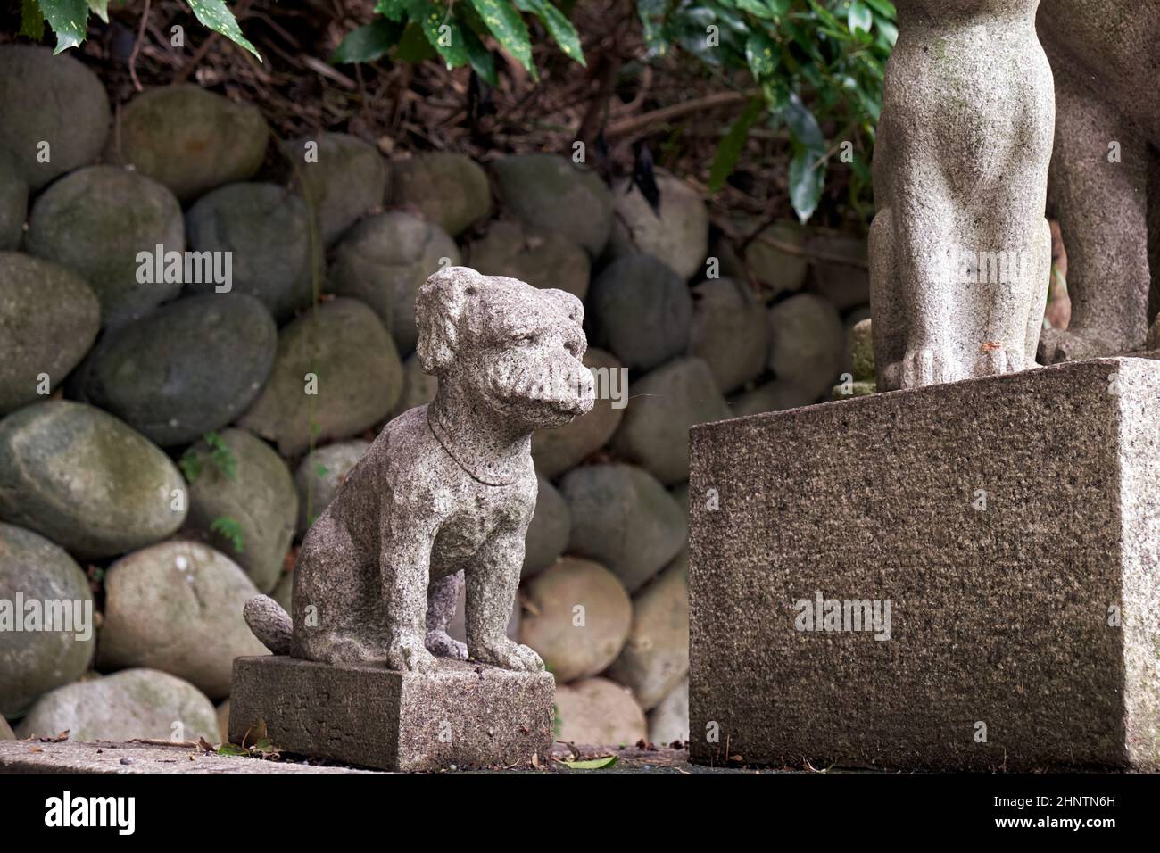 An altar with the statues of dog at the area which is dedicated to the ...
