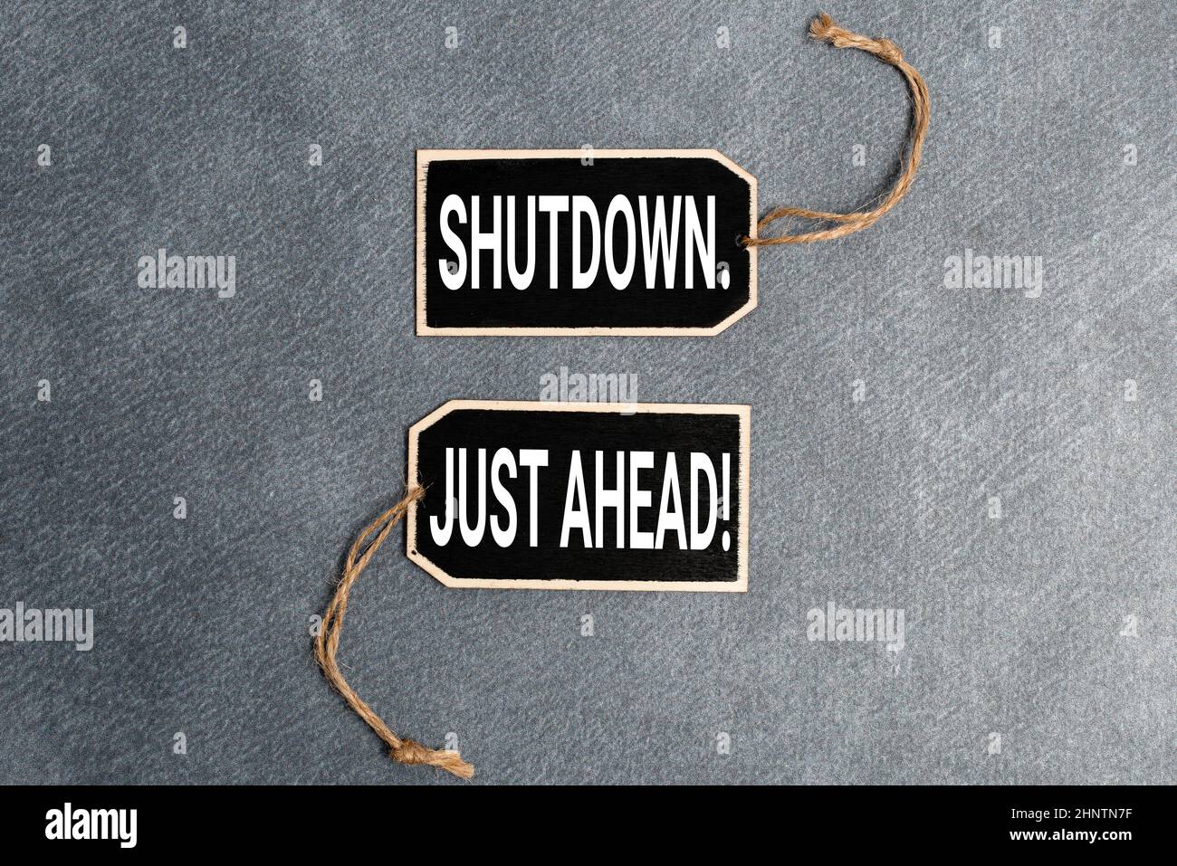 Sign displaying Shutdown Just Ahead, Business showcase closing factory ...