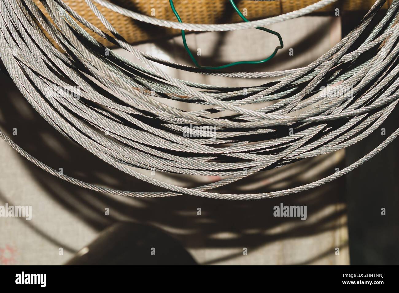 Steel cable. hank of metal rope. working tool Stock Photo - Alamy