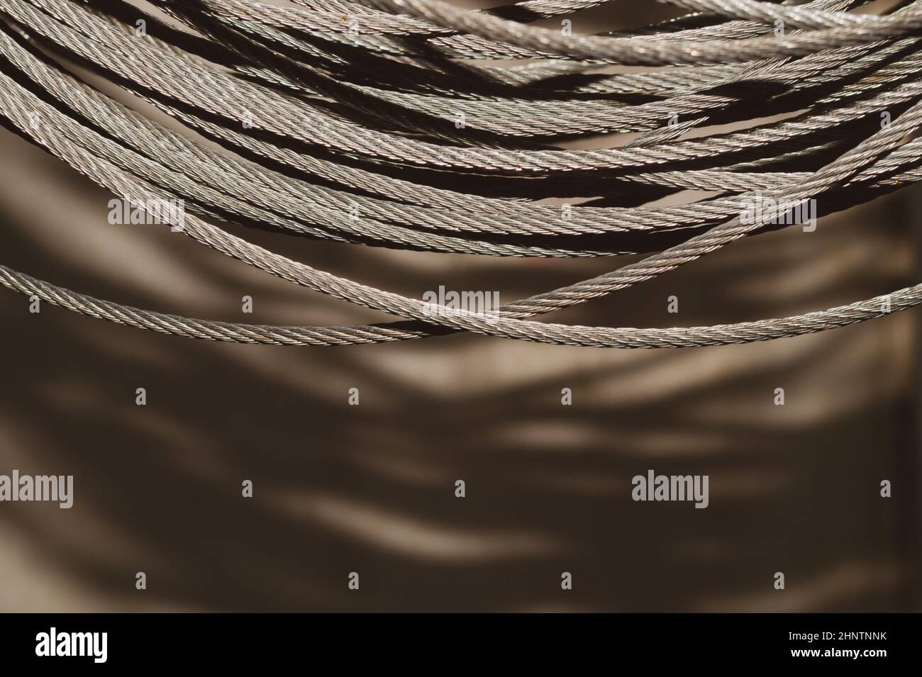 Steel cable. hank of metal rope. working tool Stock Photo - Alamy