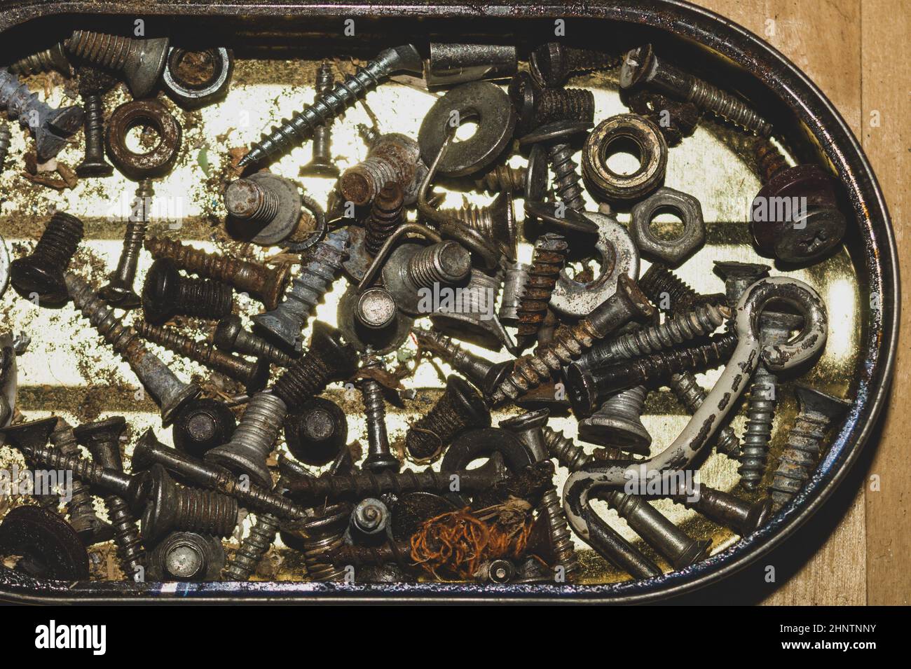 Old screws in a box. a lot of various screws. pile of fasteners in the ...