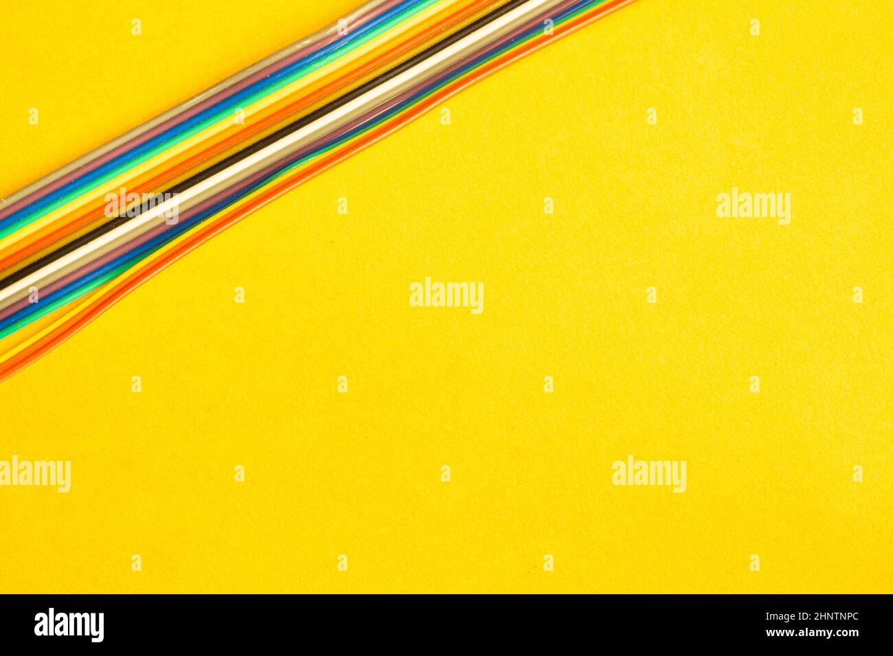 Colorful wires isolated on yellow background. connection wire for ...