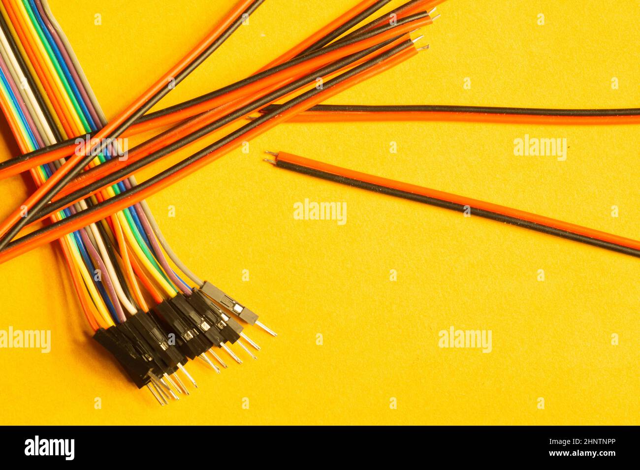 Colorful wires isolated on yellow background. connection wire for ...