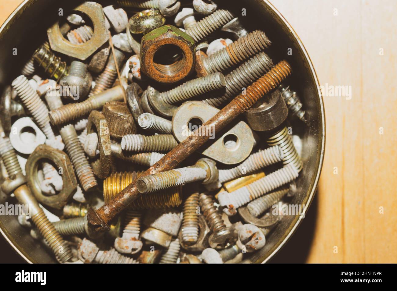 Old screws in a box. a lot of various screws. pile of fasteners in the ...