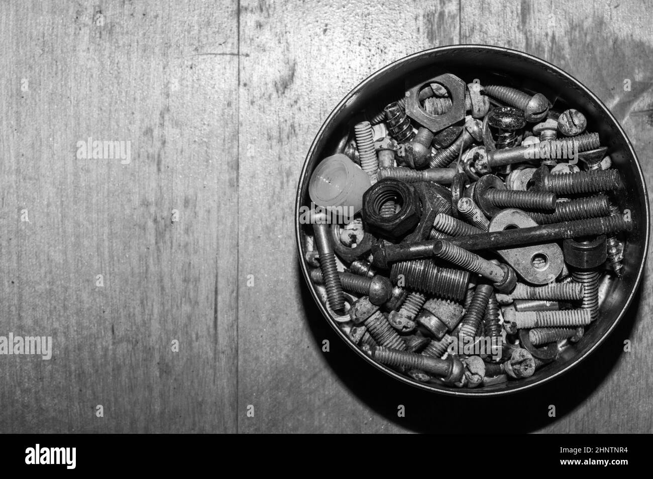 Old screws in a box. a lot of various screws. pile of fasteners in the ...
