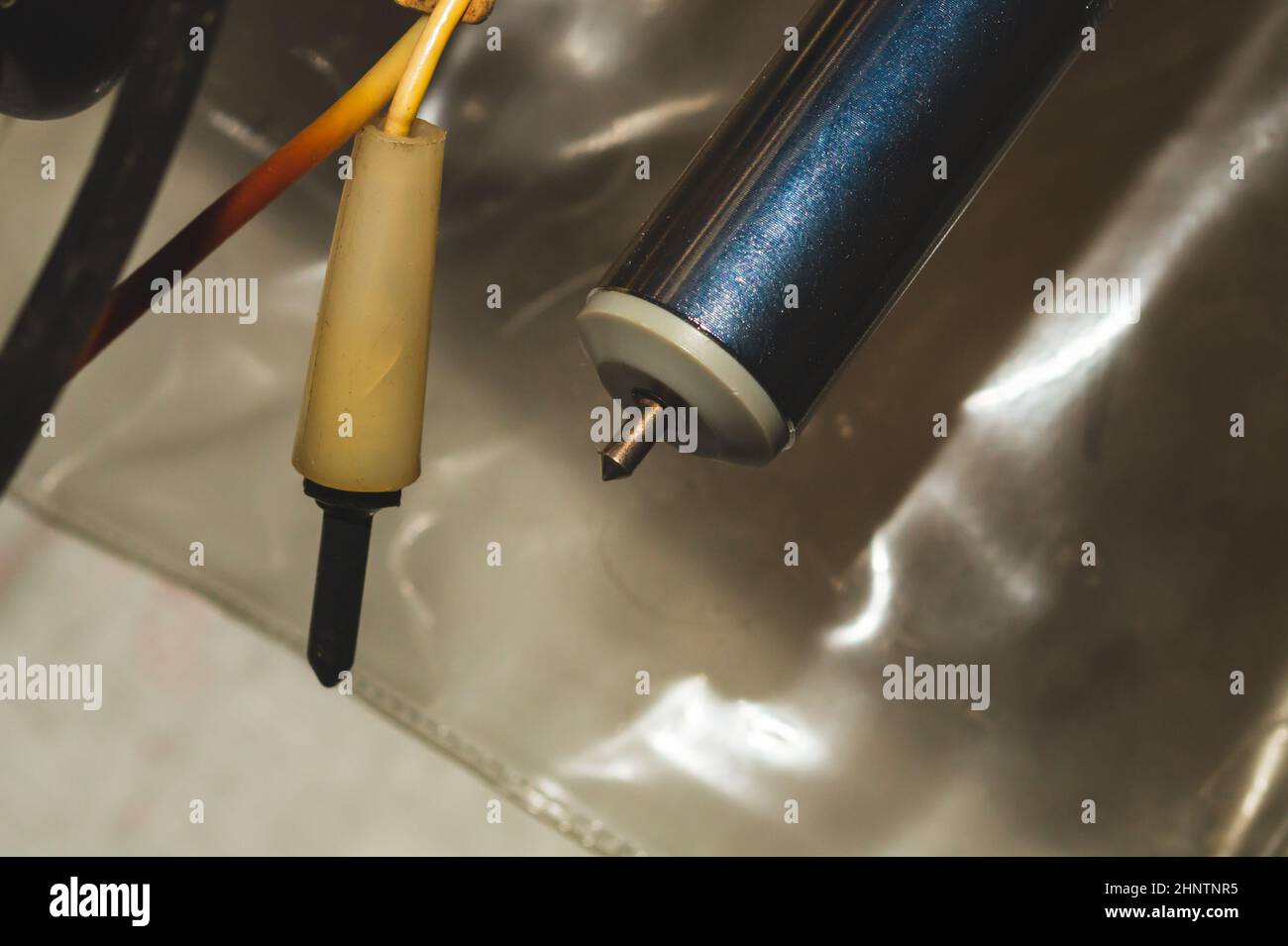Old electrical probes hanging in the workshop. multimeter probe Stock ...