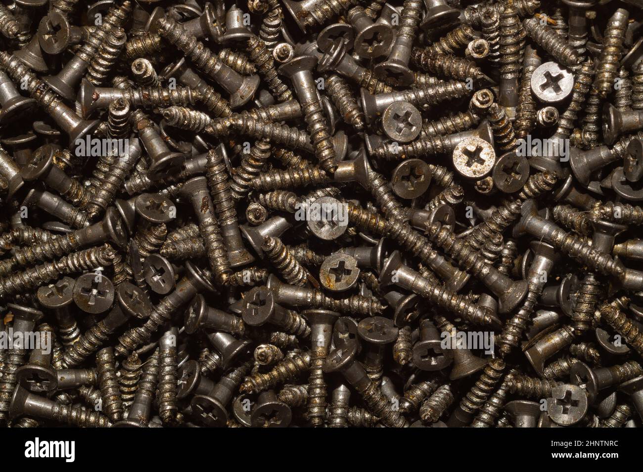 Screws background. heap of tapping screws. work tool. pile of fasteners ...