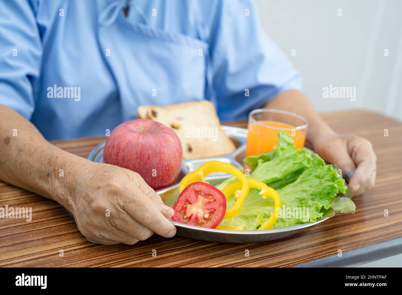 Male patient eating food in the hospital hi-res stock photography and ...