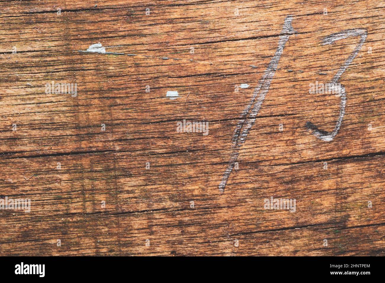 Wood surface with drawn number thirteen. old wooden texture. scratched ...