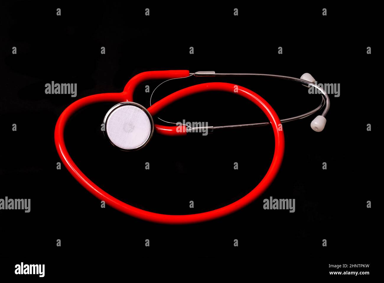 Red stethoscope, close up and still life of a modern stethoscope for ...