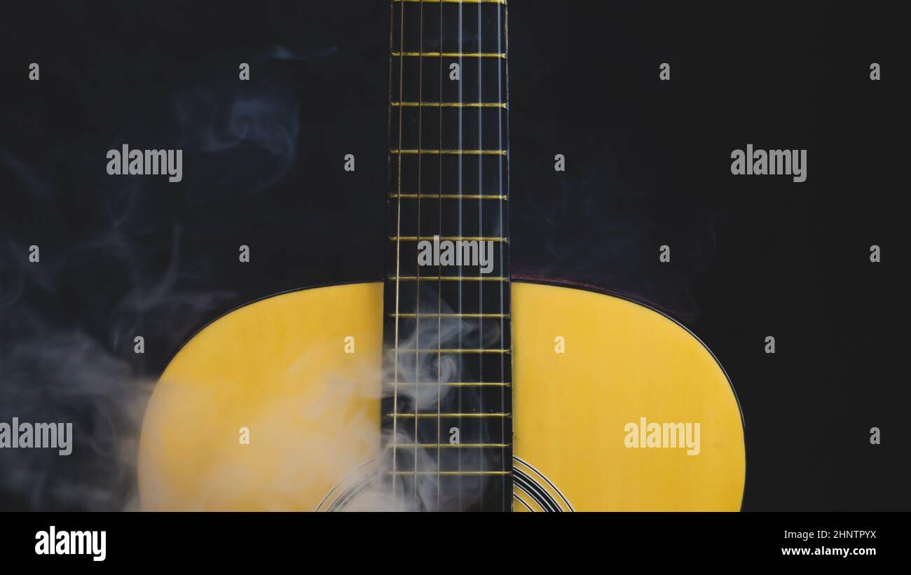 Guitar in smoke close up. musical instrument. strings on the guitar ...