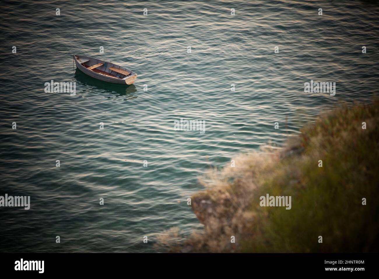 High angle image of a empty wooden boat floating on water Stock Photo ...