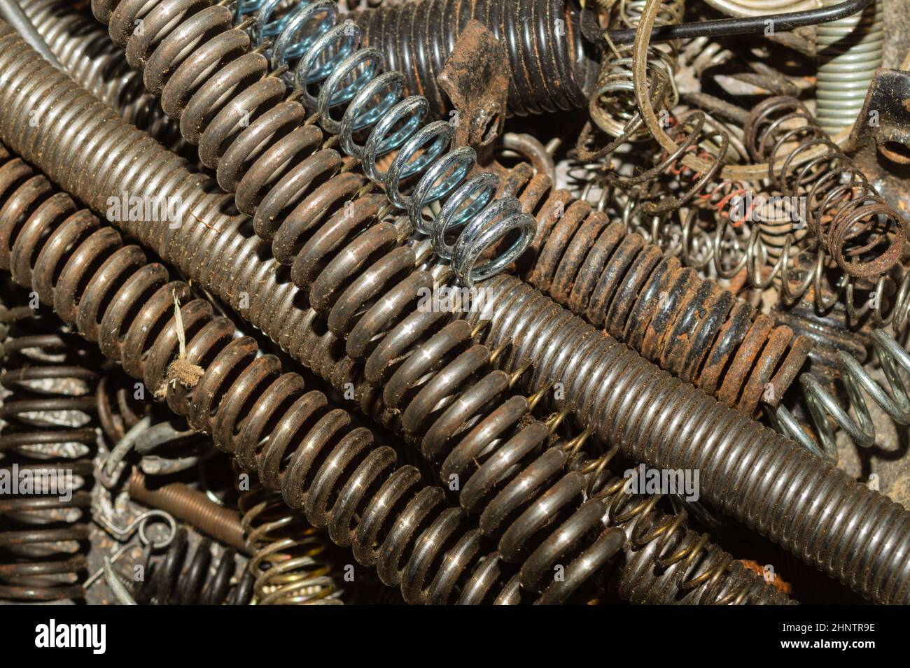 Pile metal springs hi-res stock photography and images - Alamy