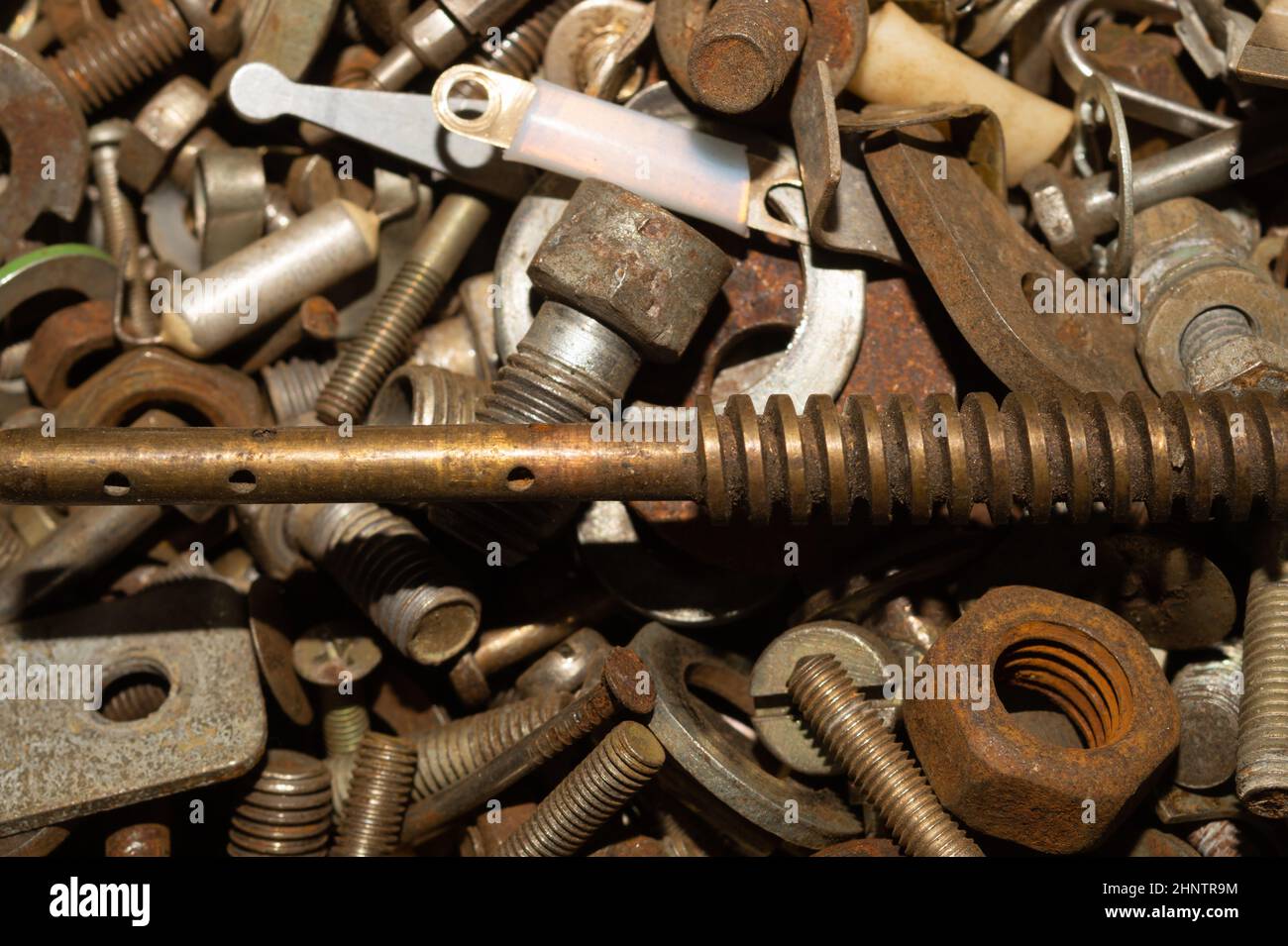 Pile of fasteners and screws close up. scrap metal. different metal ...