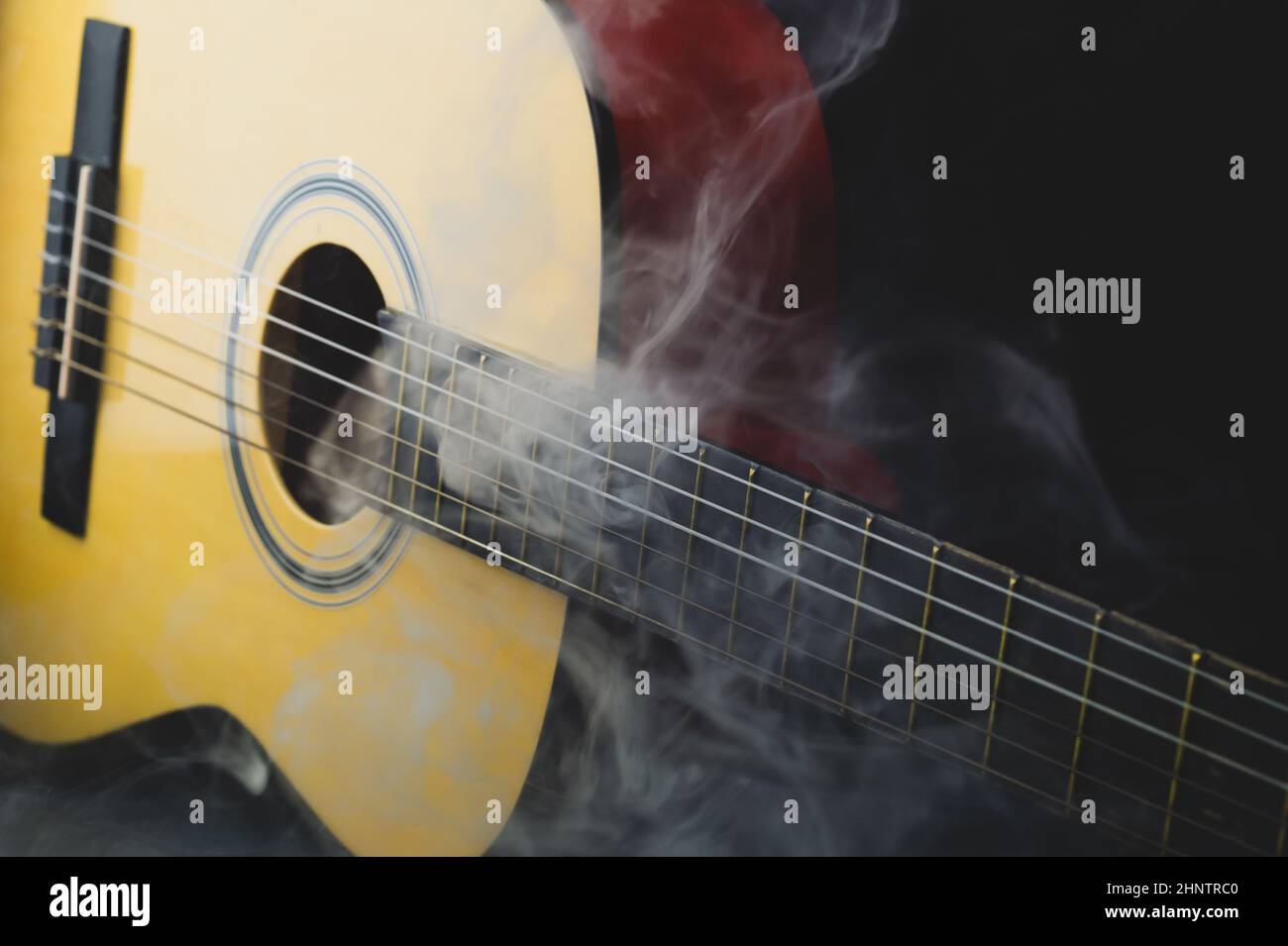 Guitar in smoke close up. musical instrument. strings on the guitar ...