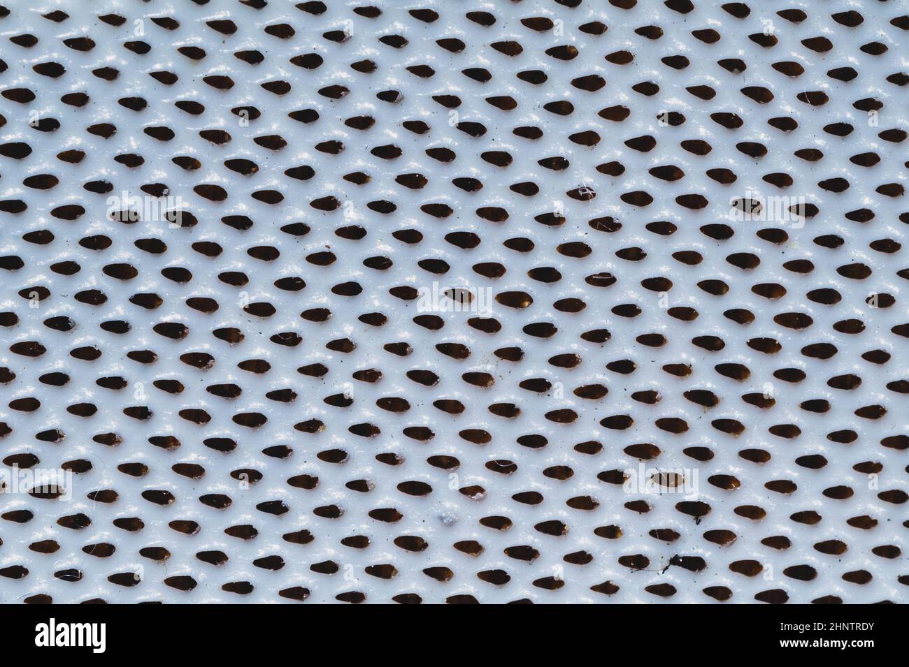 Rubber surface with uneven holes. white plastic texture with dots ...
