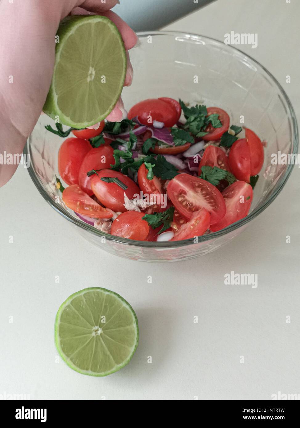 Woman hand squeezes fresh lime hi-res stock photography and images - Alamy