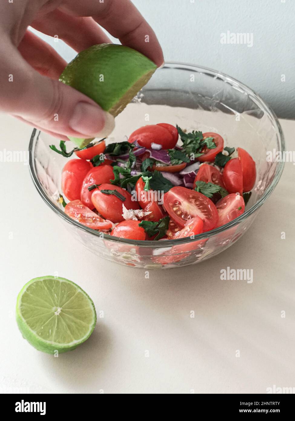 Woman hand squeezes fresh lime hi-res stock photography and images - Alamy