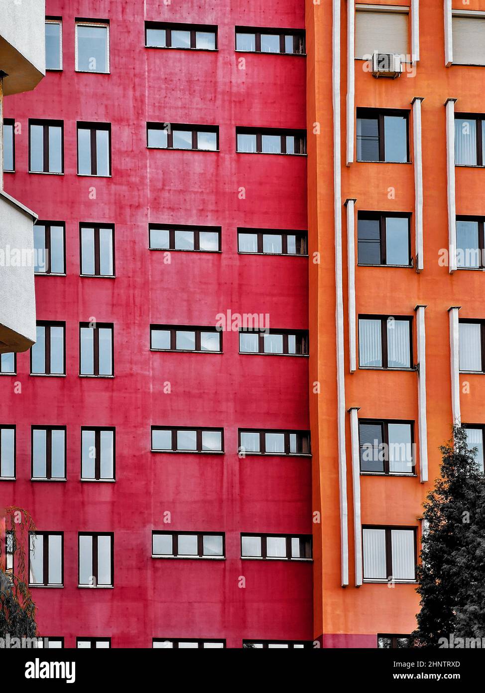 Fragments of modern urban architecture. The red and orange walls of ...
