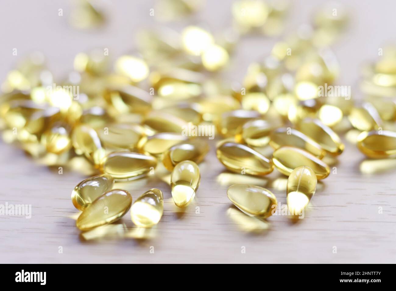 Clear capsule supplements, background image Stock Photo - Alamy