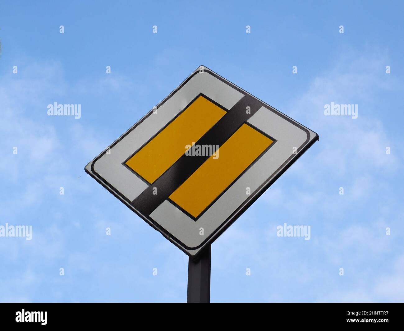 End of priority right of way road sign Stock Photo - Alamy