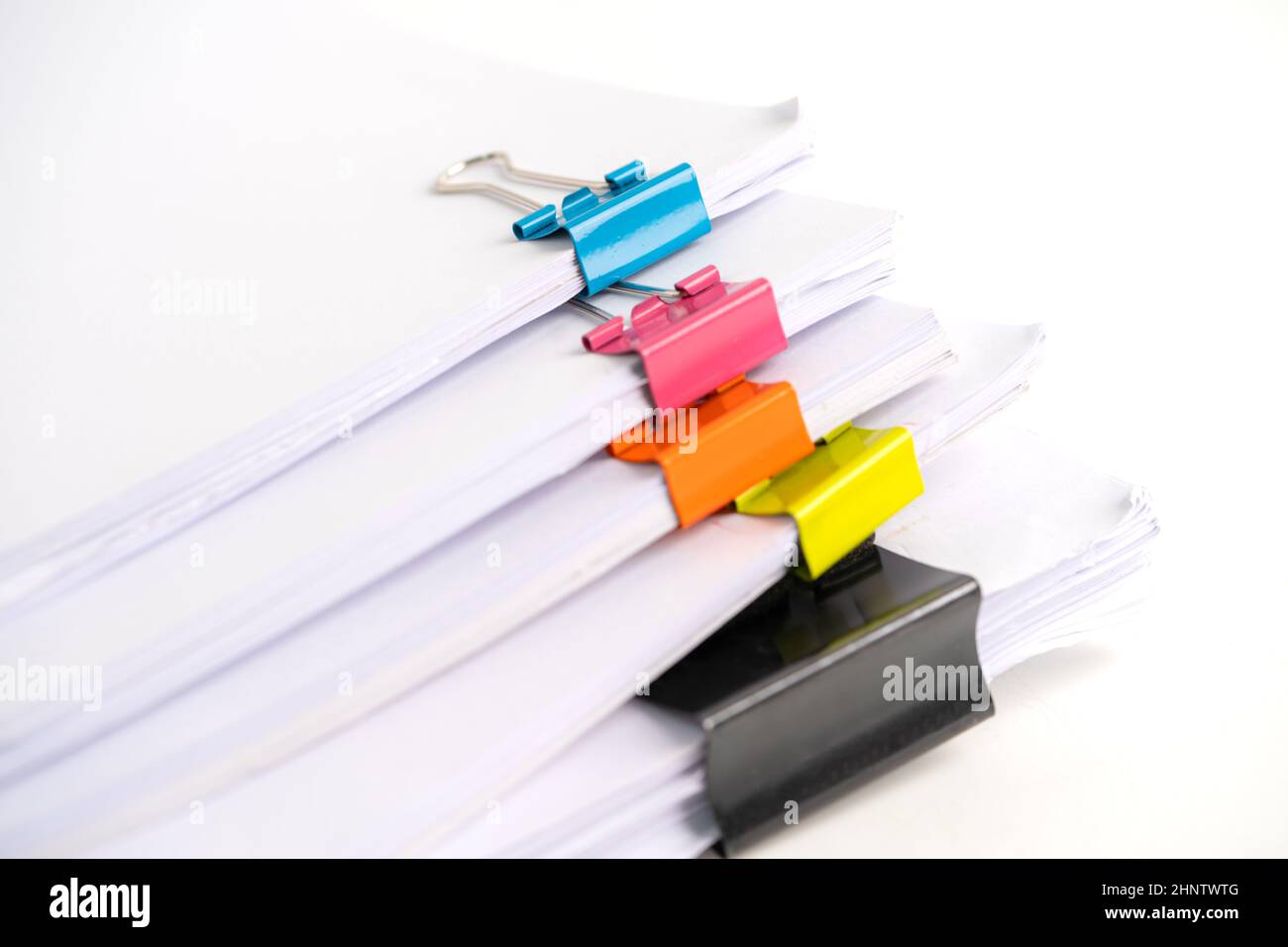 Stack of report paper files in business office clips Stock Photo - Alamy
