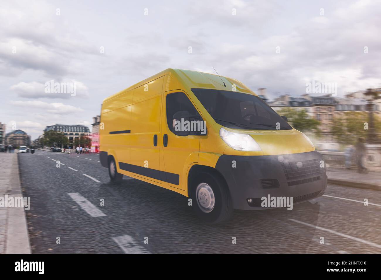 Yellow moving van on a city road Stock Photo - Alamy