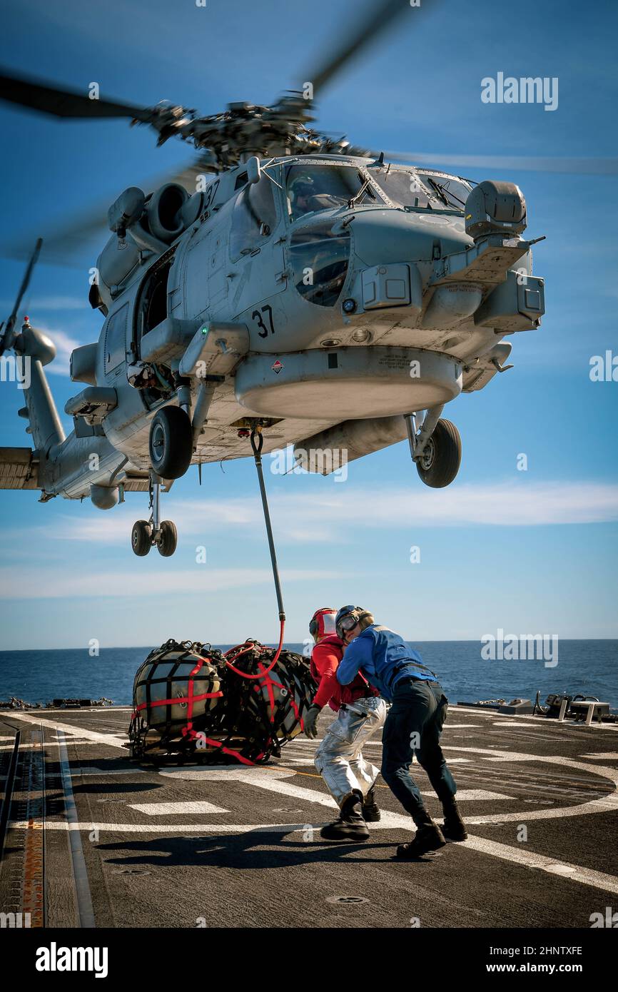 Seaman Dylan Jeffers (in blue) and Damage Controlman Fireman Bau Smith ...
