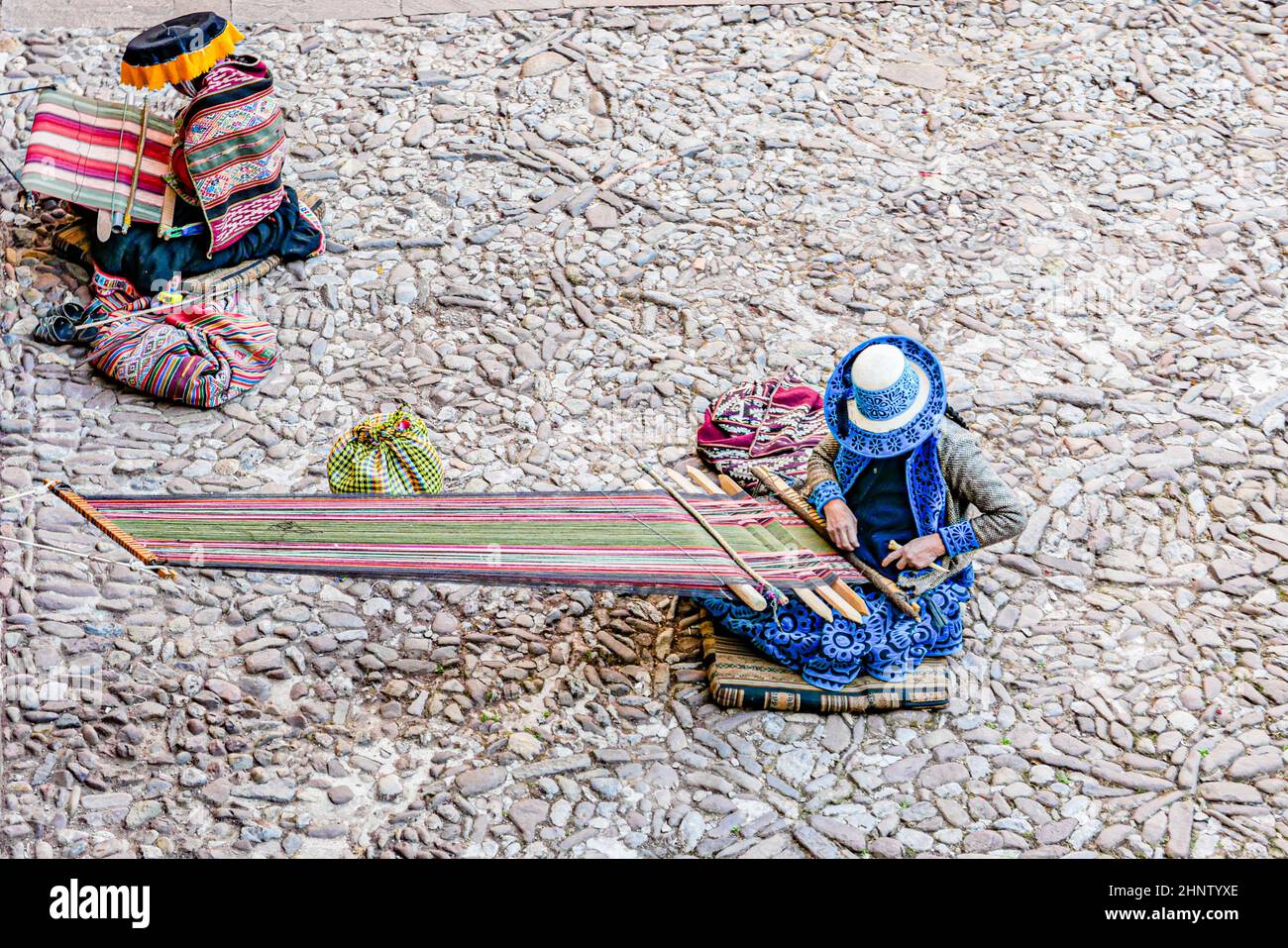 Peruvian woman - weaver in traditional dress weaving a tapestry, Peru ...