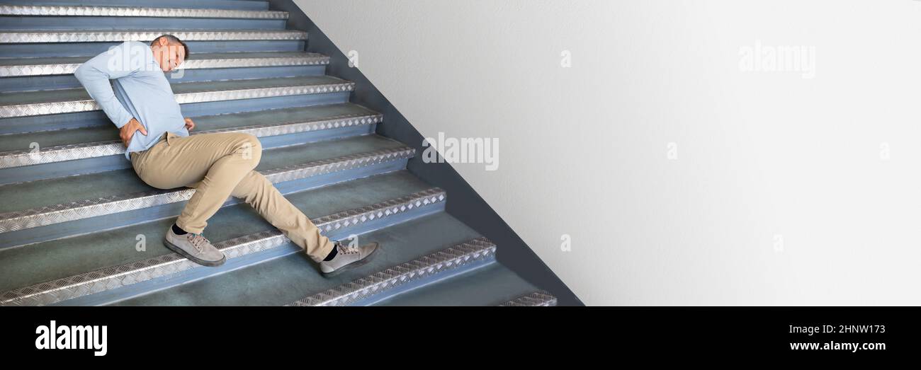 Mature Man Lying On Staircase After Slip And Fall Accident Stock Photo ...