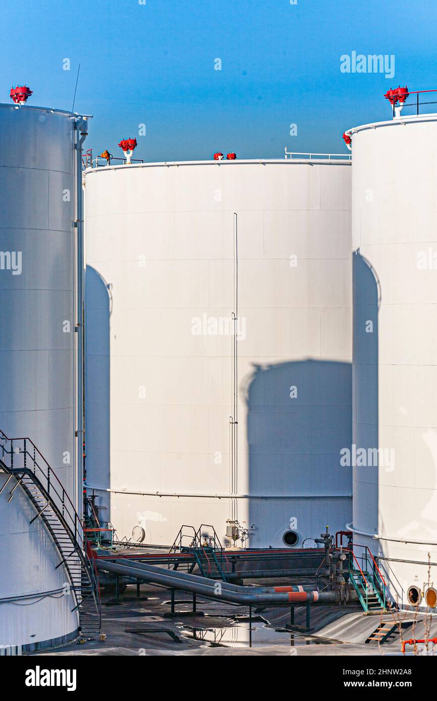 white tanks in tank farm with blue clear sky Stock Photo - Alamy