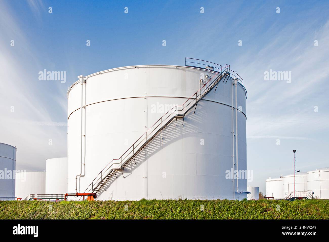 white tanks for petrol and oil in tank farm with blue sky Stock Photo ...