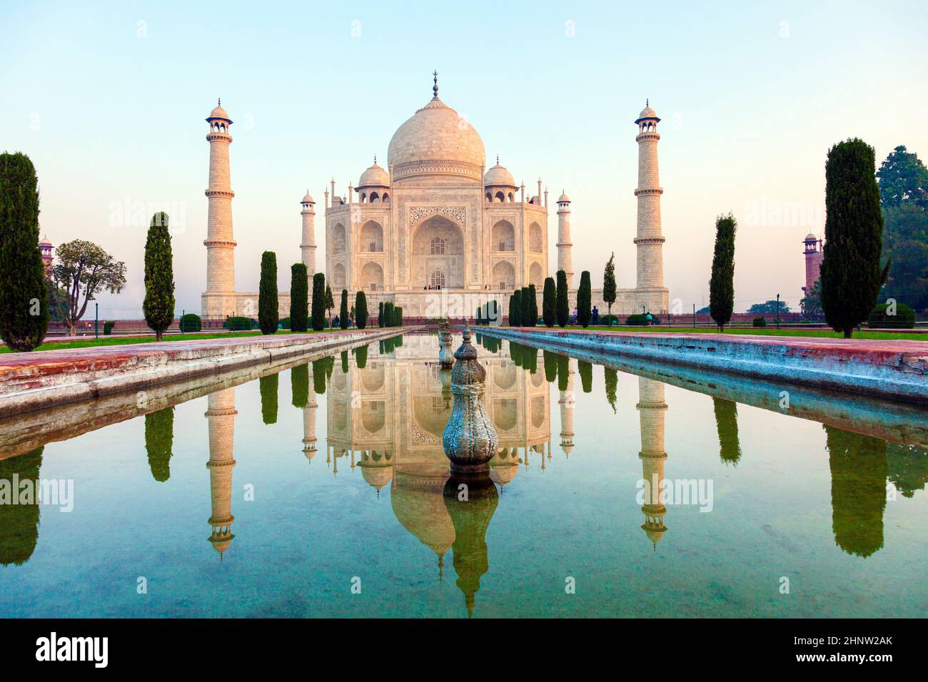 scenic Taj Mahal in India in sunrise with reflection in water Stock ...