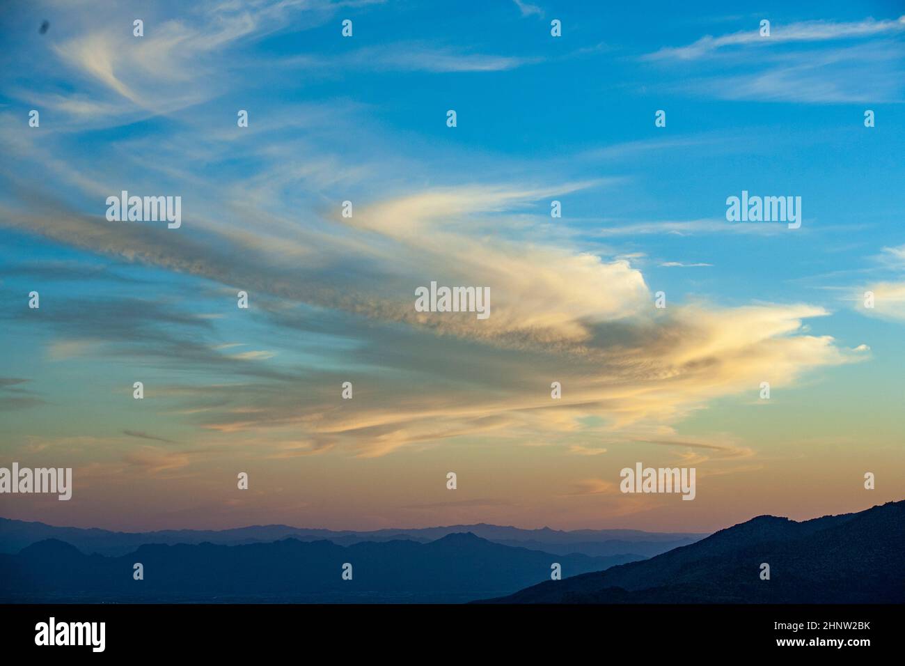 spectacular sunset with soft clouds in the desert Stock Photo - Alamy