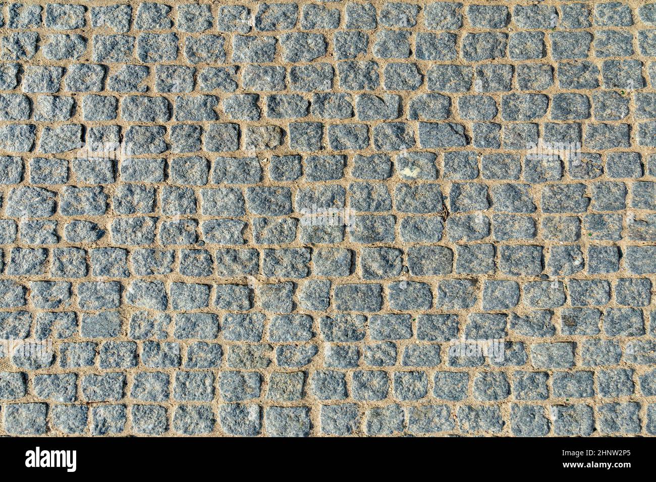 harmonic pattern of old paved cobblestone street Stock Photo - Alamy