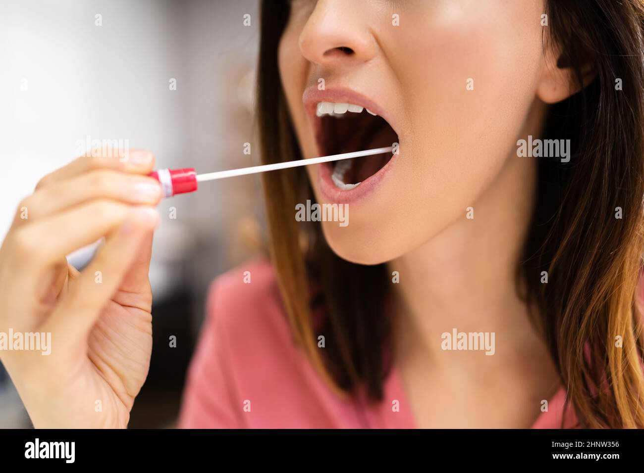 DNA Mouth Saliva Test Swab. Woman Doing Check Stock Photo - Alamy
